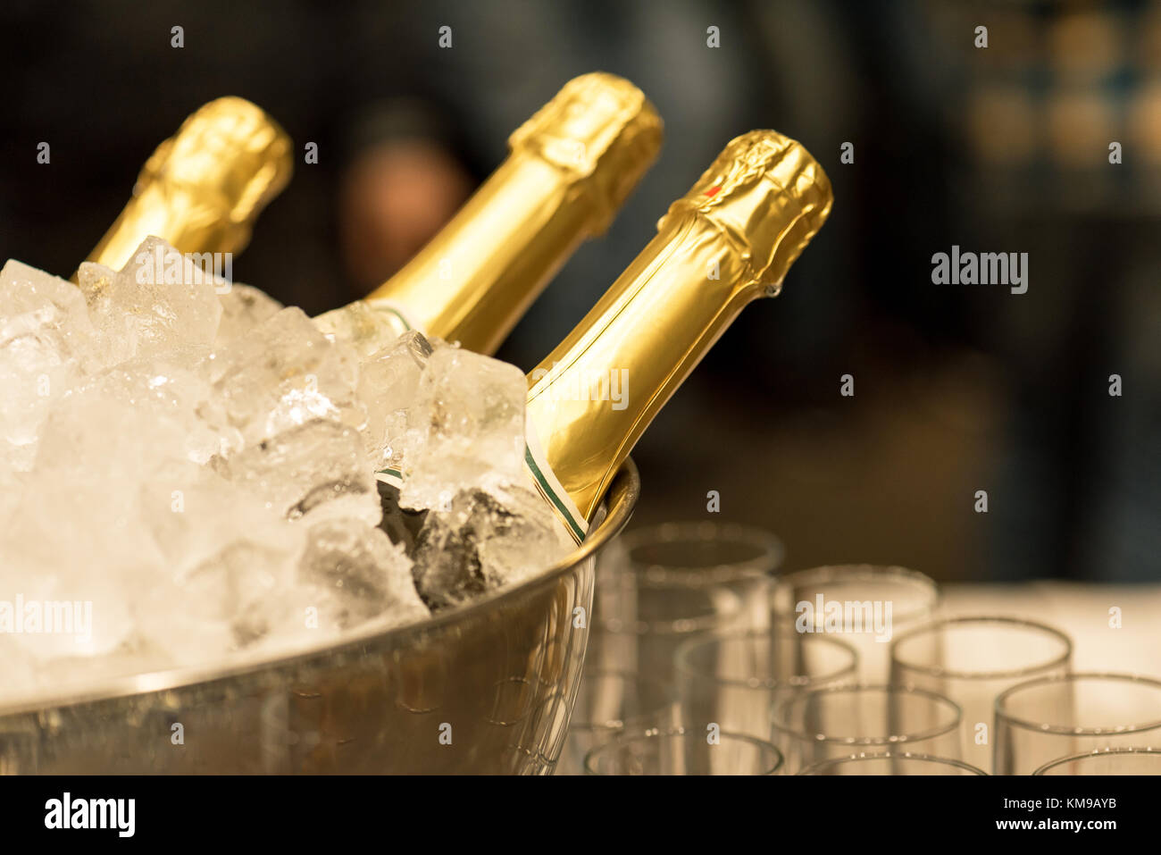 Bottle of champagne in bucket of ice Stock Photo - Alamy