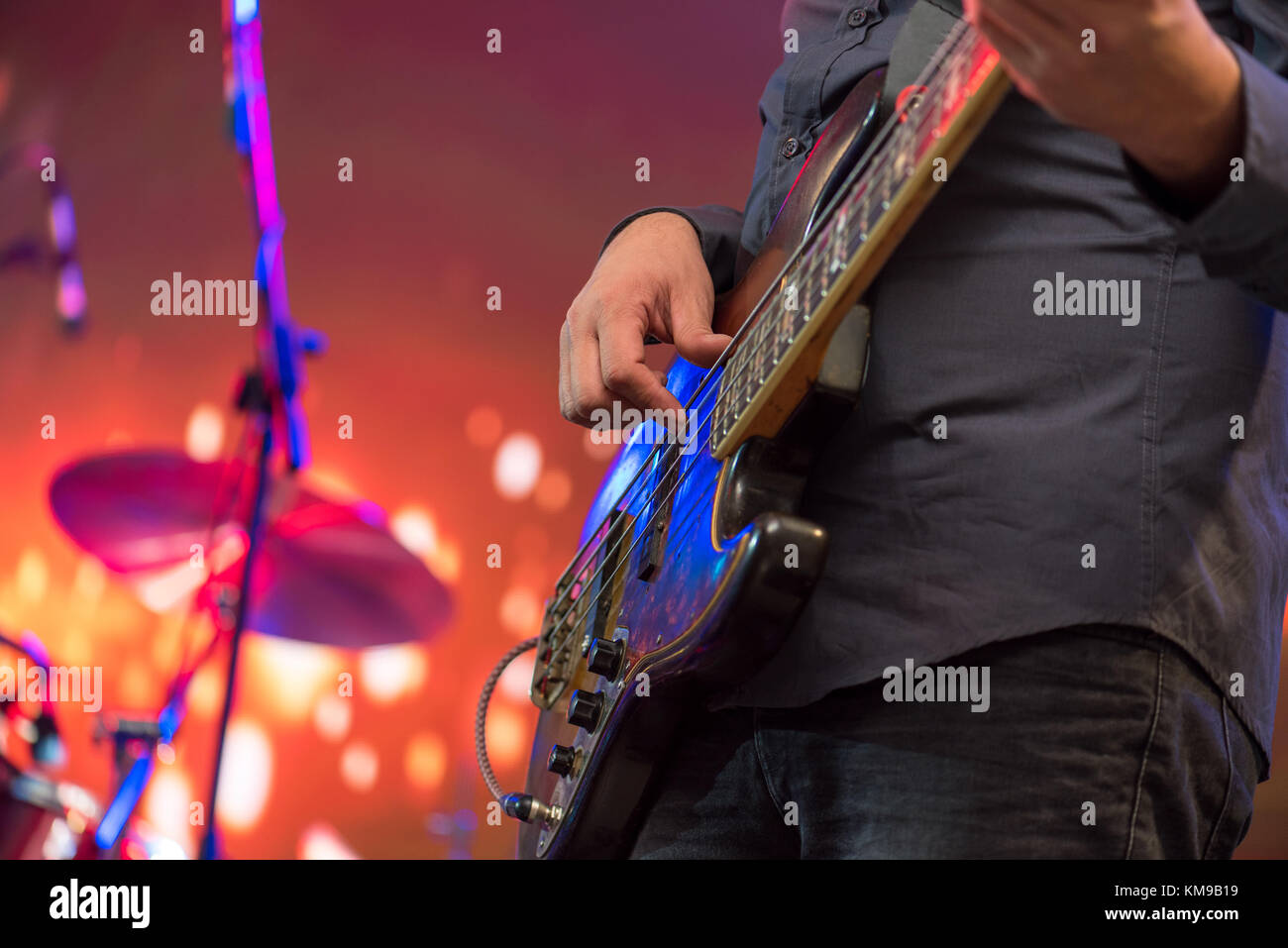Man playing guitar on a stage musical concert close-up view Stock Photo ...