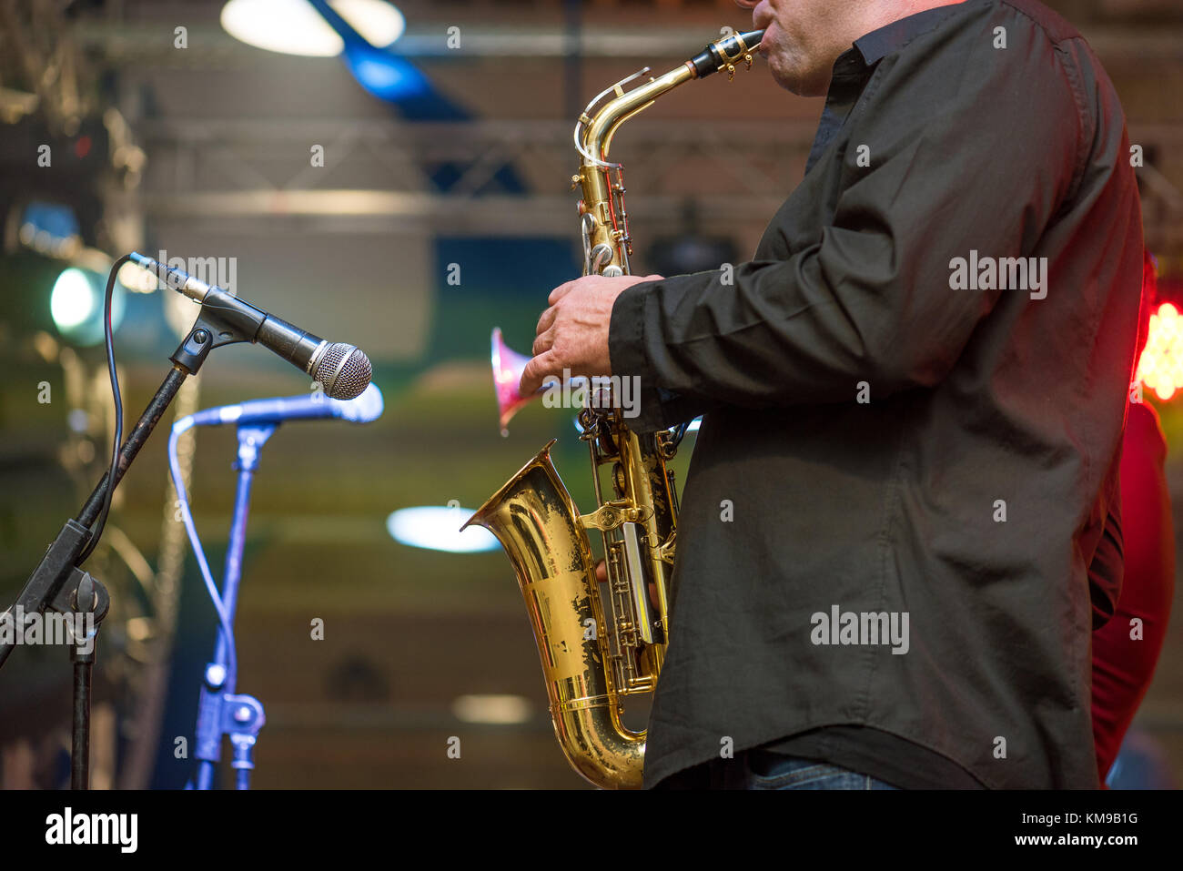 Musicial music live band performing on a stage with different lights ...