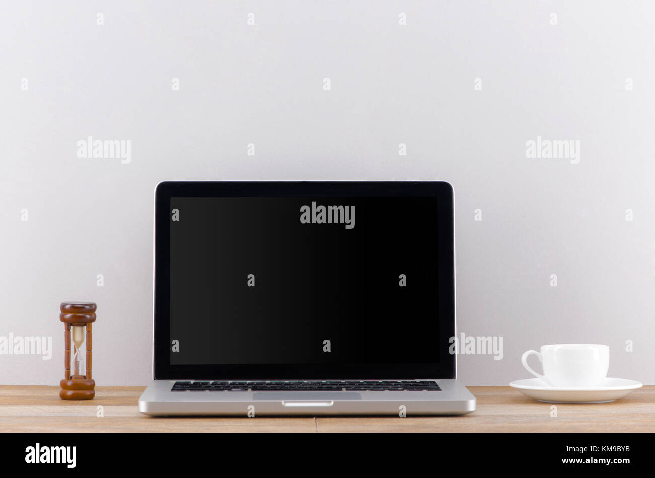 laptop computer white blank screen on work table front view Stock Photo - Alamy