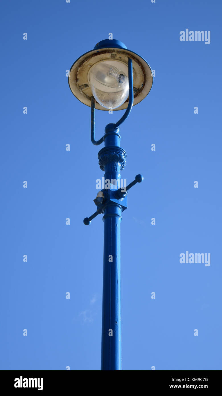 A Bright blue old style lamp post Stock Photo - Alamy