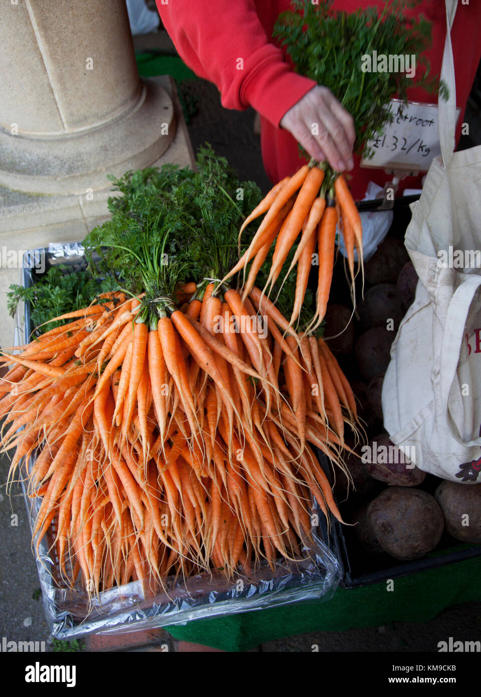 Tempting bunches of carrots on a vegetable stall at the award winning ...