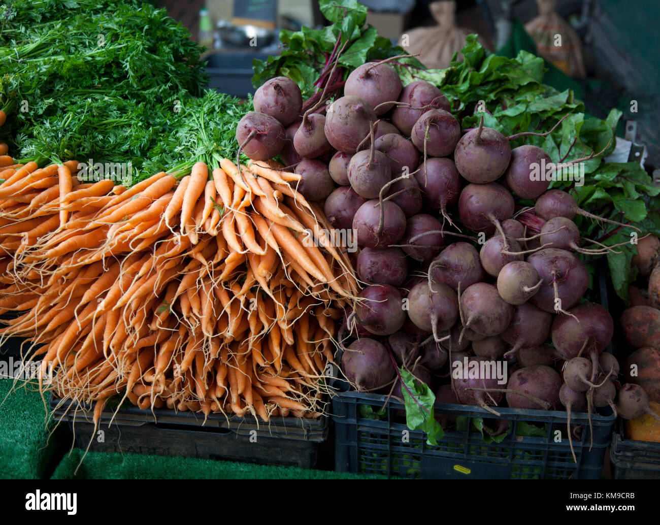 Carrots and beetroot are piled high on a stall at the award winning ...