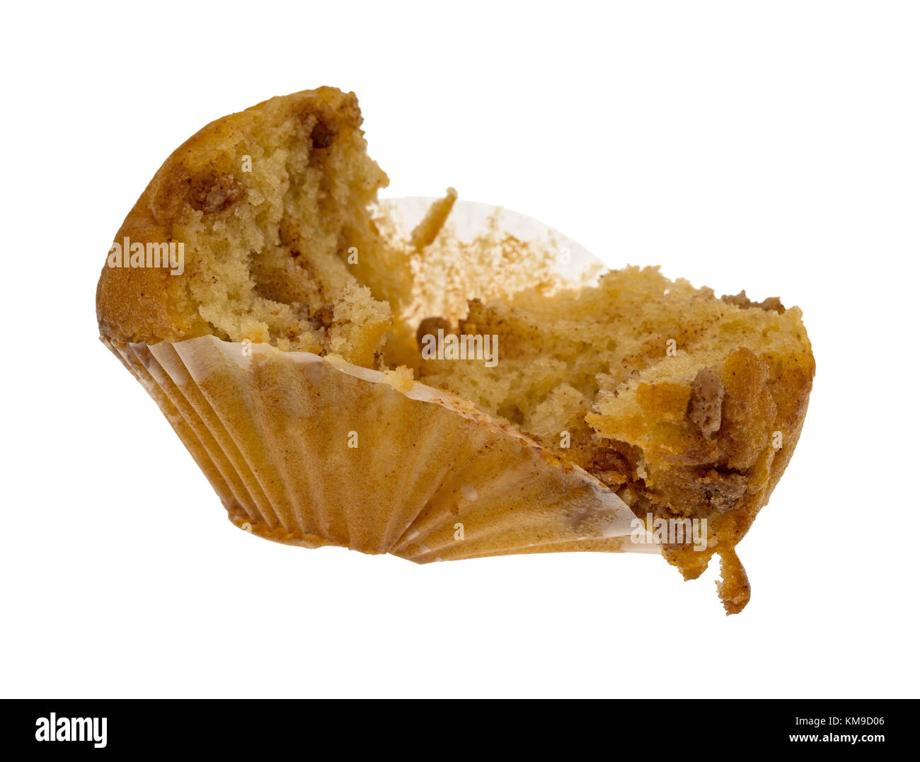 Side view of a bite size apple spice muffin broken isolated on a white ...