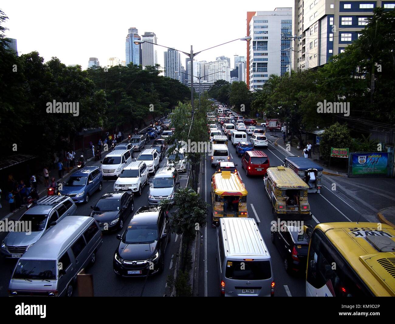 PASIG CITY, PHILIPPINES - NOVEMBER 28, 2017: Vehicles go through a ...