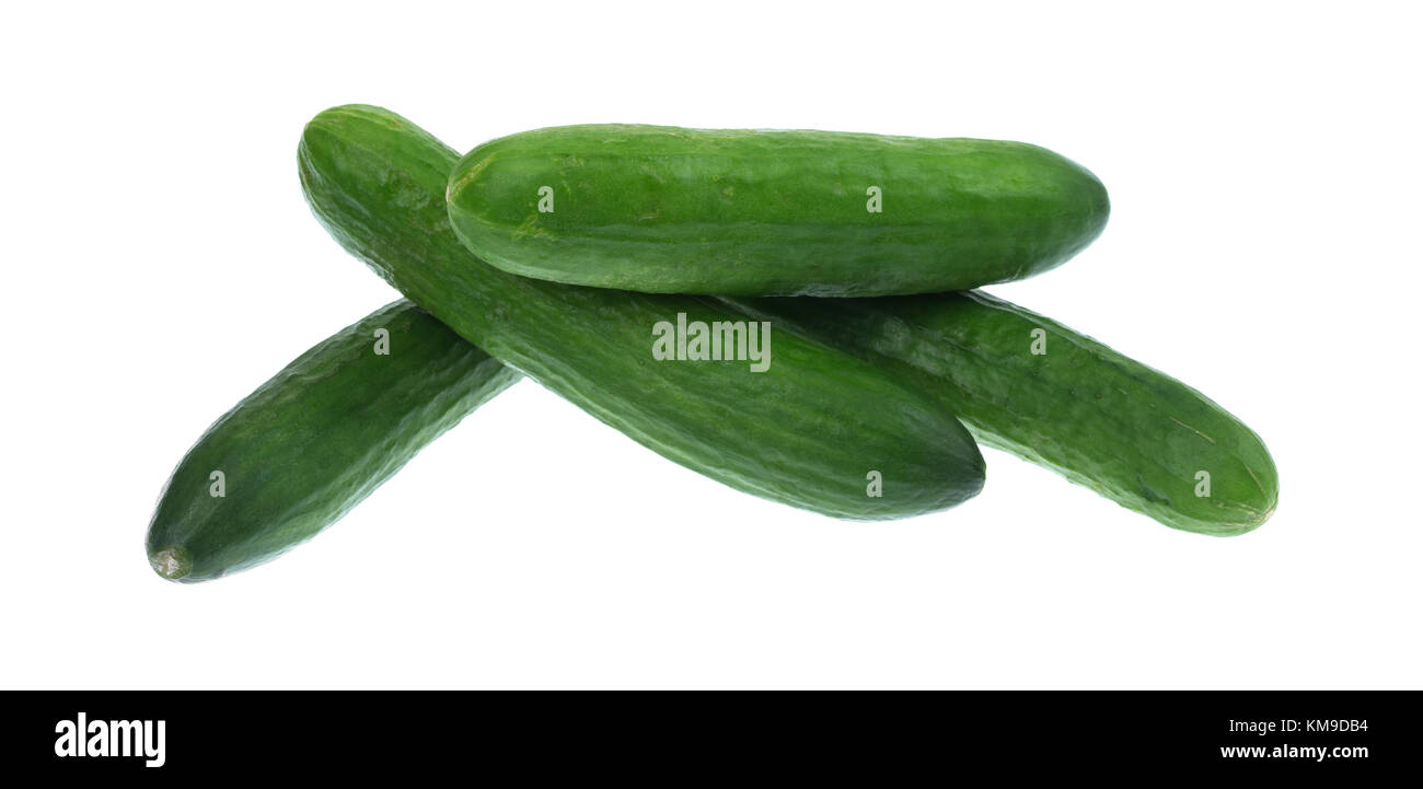 Several small bite size dipping cucumbers isolated on white background ...