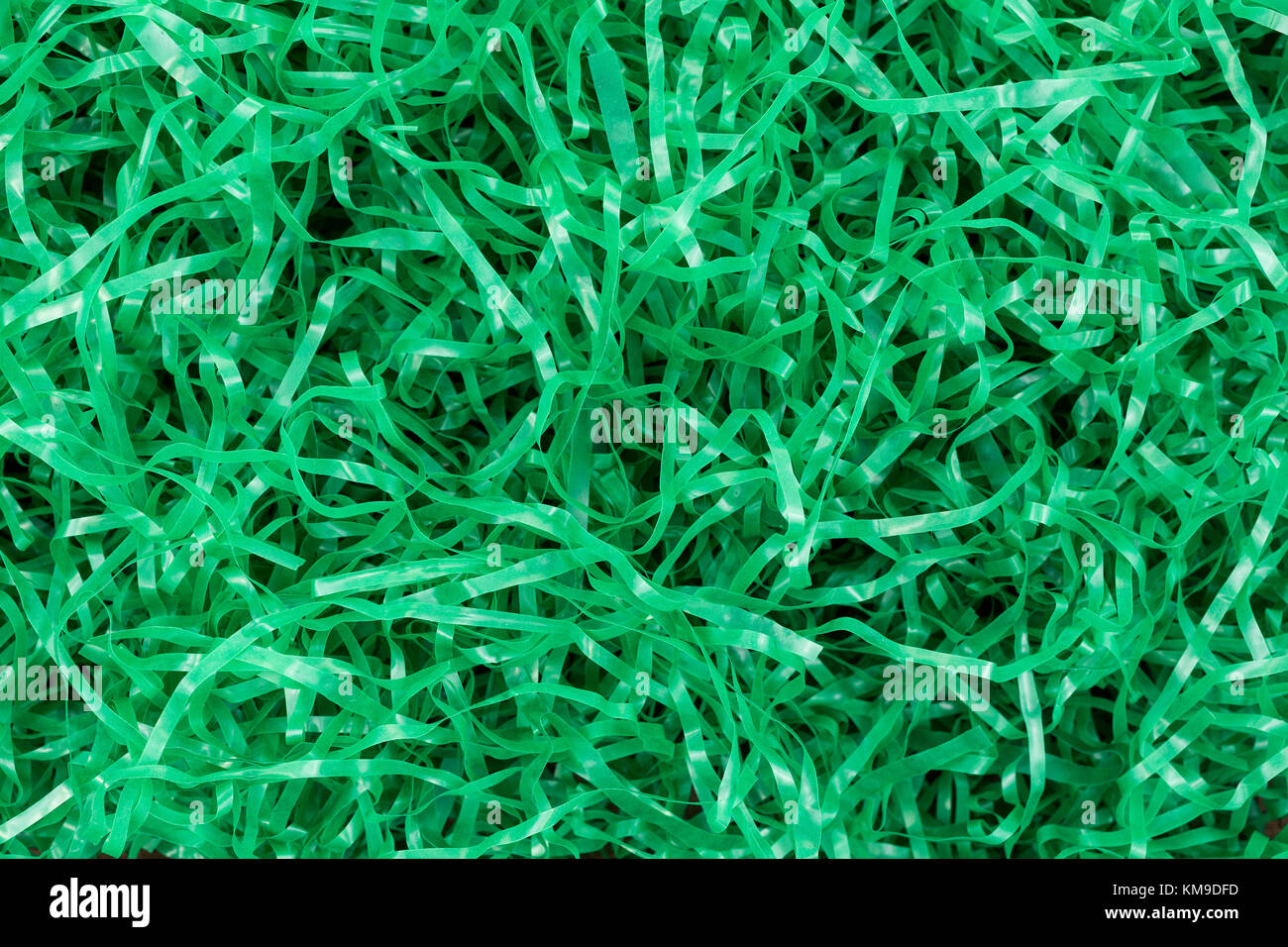 Top view of shredded green plastic Easter grass for lining baskets ...