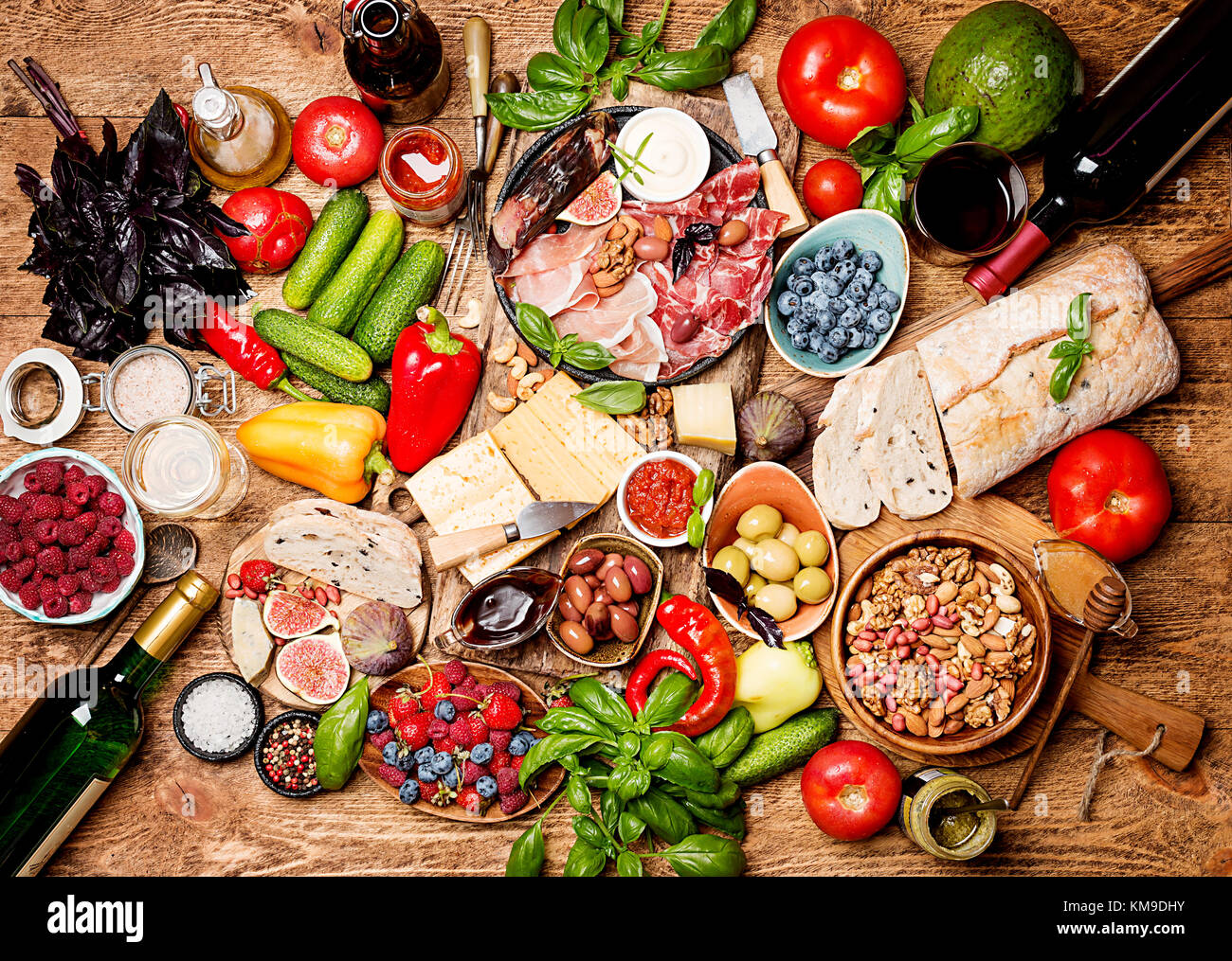 Top view table full of food. Italian antipasti wine snacks set. Cheese ...