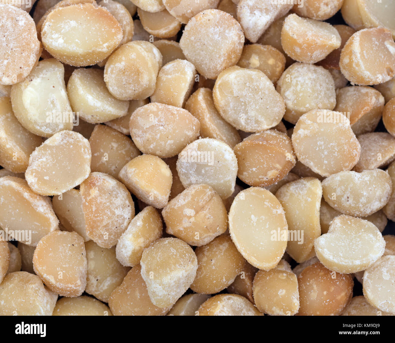 A very close view of dry roasted and salted macadamia nuts Stock Photo ...