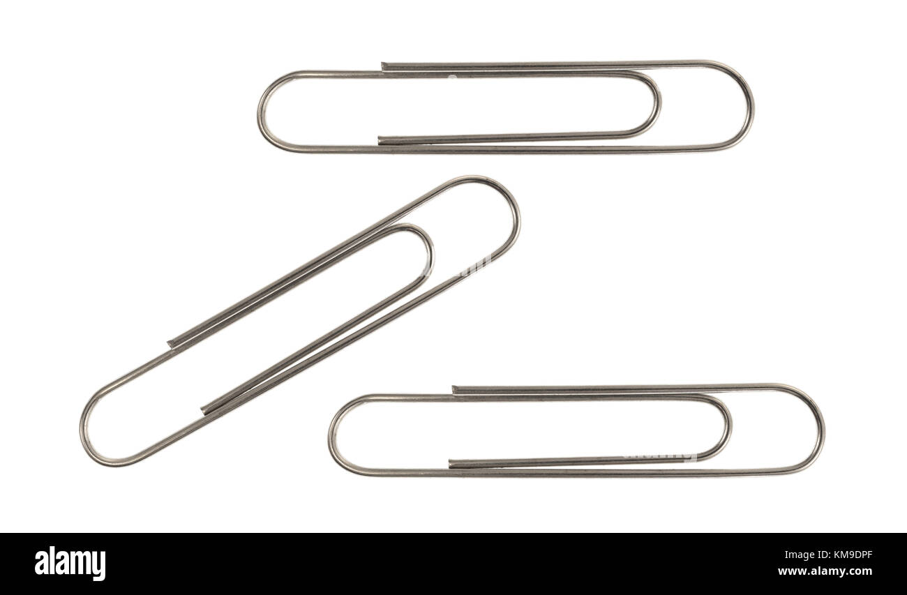 Three metal paper clips isolated on a white background Stock Photo - Alamy