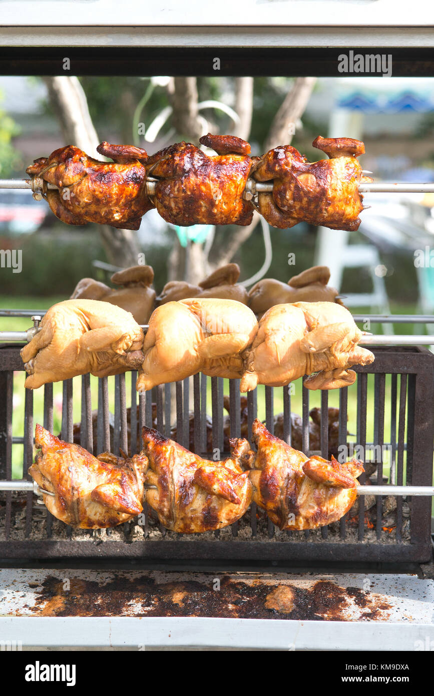 Grilled Chicken on steel plug is rotation Stock Photo - Alamy