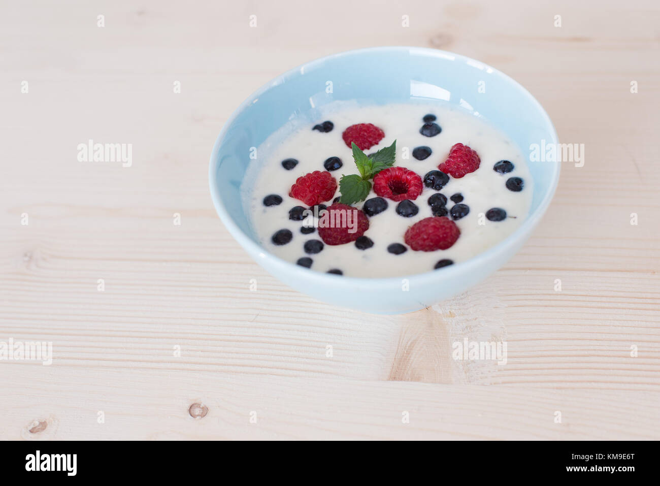 Yogurt with blueberries and raspberries Stock Photo - Alamy