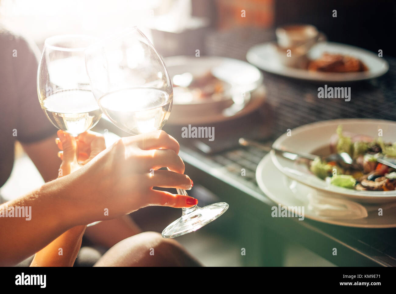 Friends making toast sitting hi-res stock photography and images - Alamy