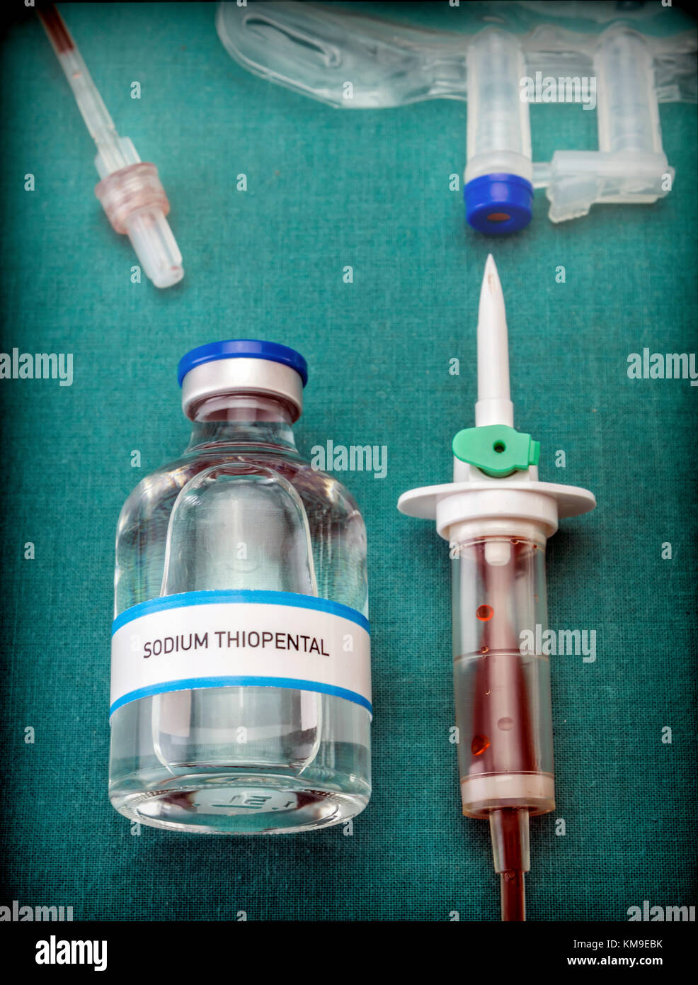 Rubber drip irrigation system with traces of blood along with vial of ...