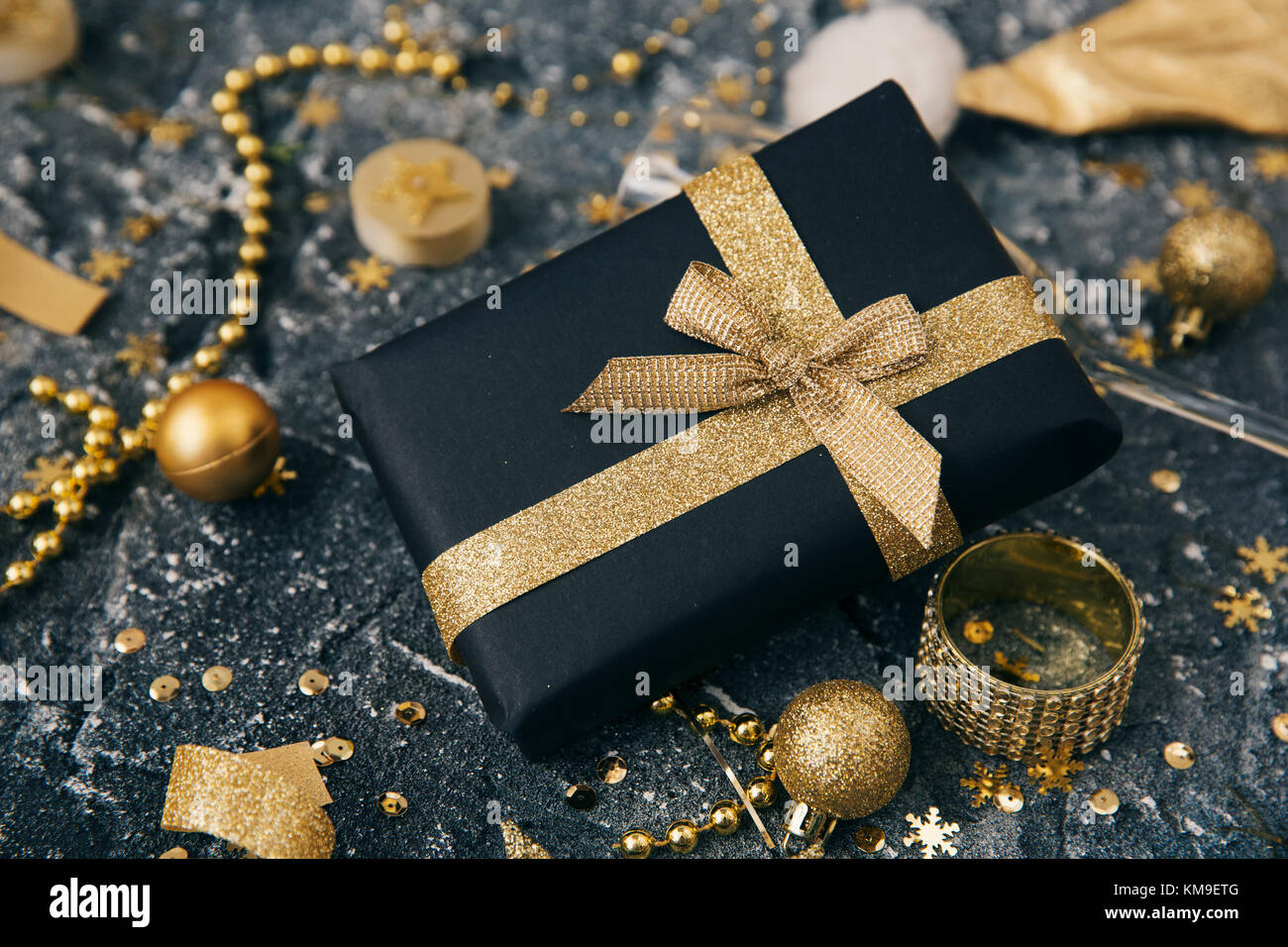 Christmas gift box with gold decorations Stock Photo - Alamy