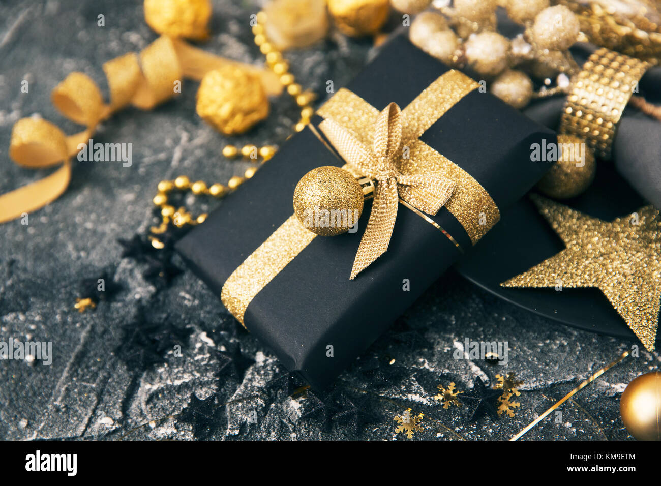 Christmas gift box with gold decorations Stock Photo - Alamy