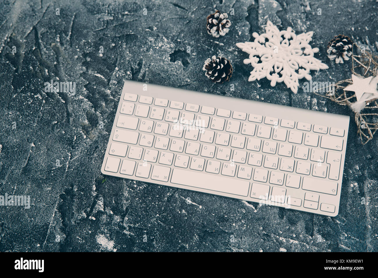 Computer keyboard with pine cones and star shape decorations Stock ...