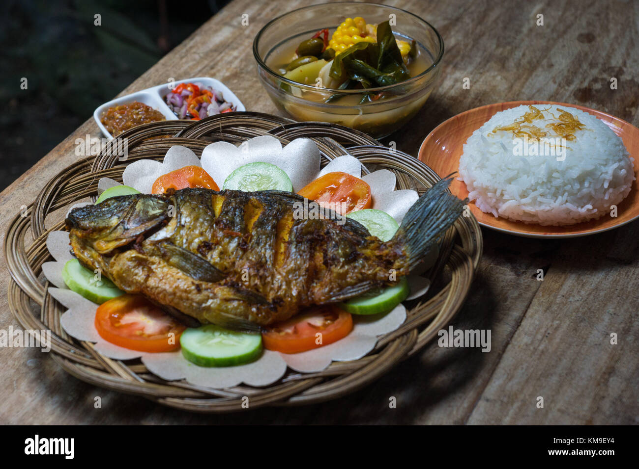 Fried goldfish with rice and vegetables Stock Photo - Alamy