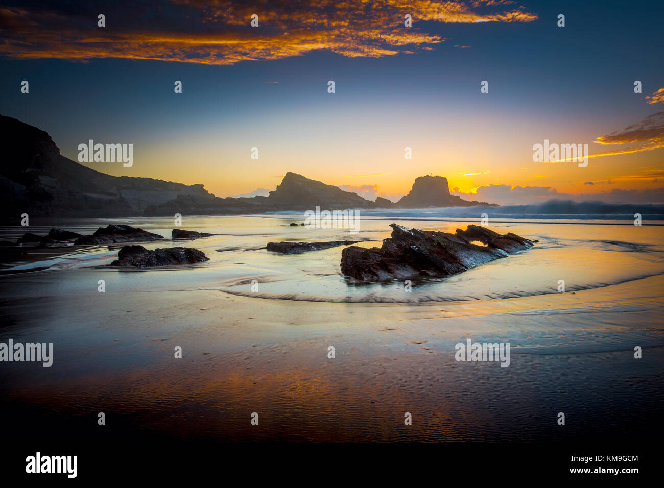 Beautiful orange sunset at the beach Stock Photo - Alamy