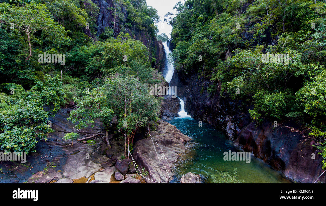 A stunning blue water fall in the rocky and green mountains Stock Photo ...