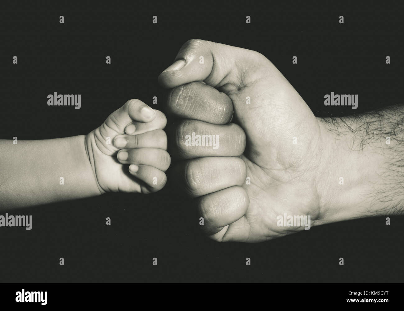Baby hand & Father Hand Stock Photo - Alamy