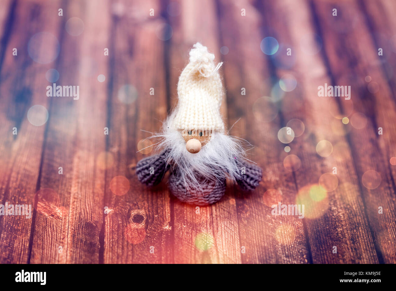 Small Santa decorations on wooden floor Stock Photo - Alamy