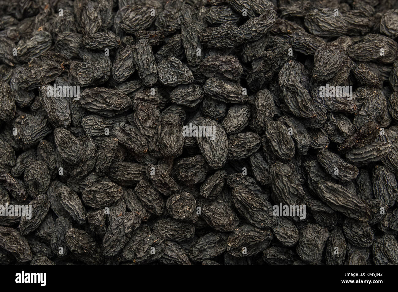 Background of lined dark raisins. Top view of the oriental treats ...