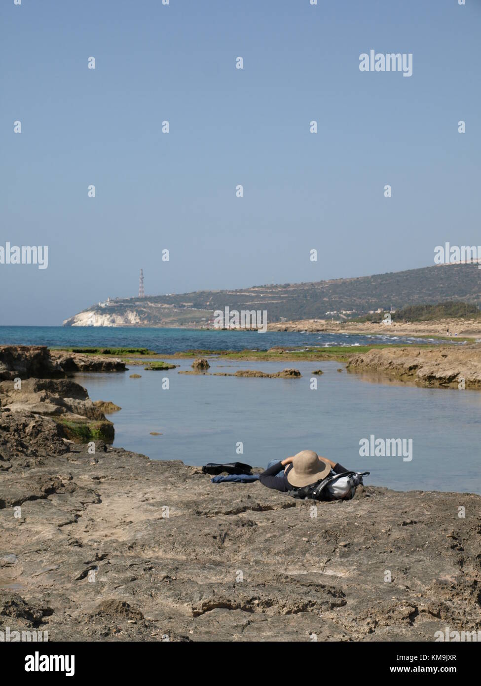 Woman sleeping on rocks hi-res stock photography and images - Alamy