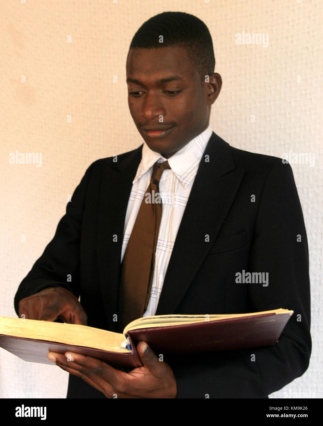 African man reading Stock Photo - Alamy