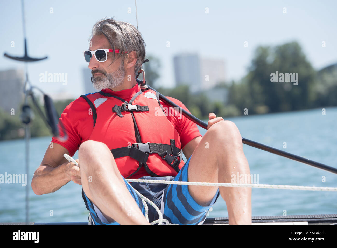 man wearing life jacket Stock Photo - Alamy