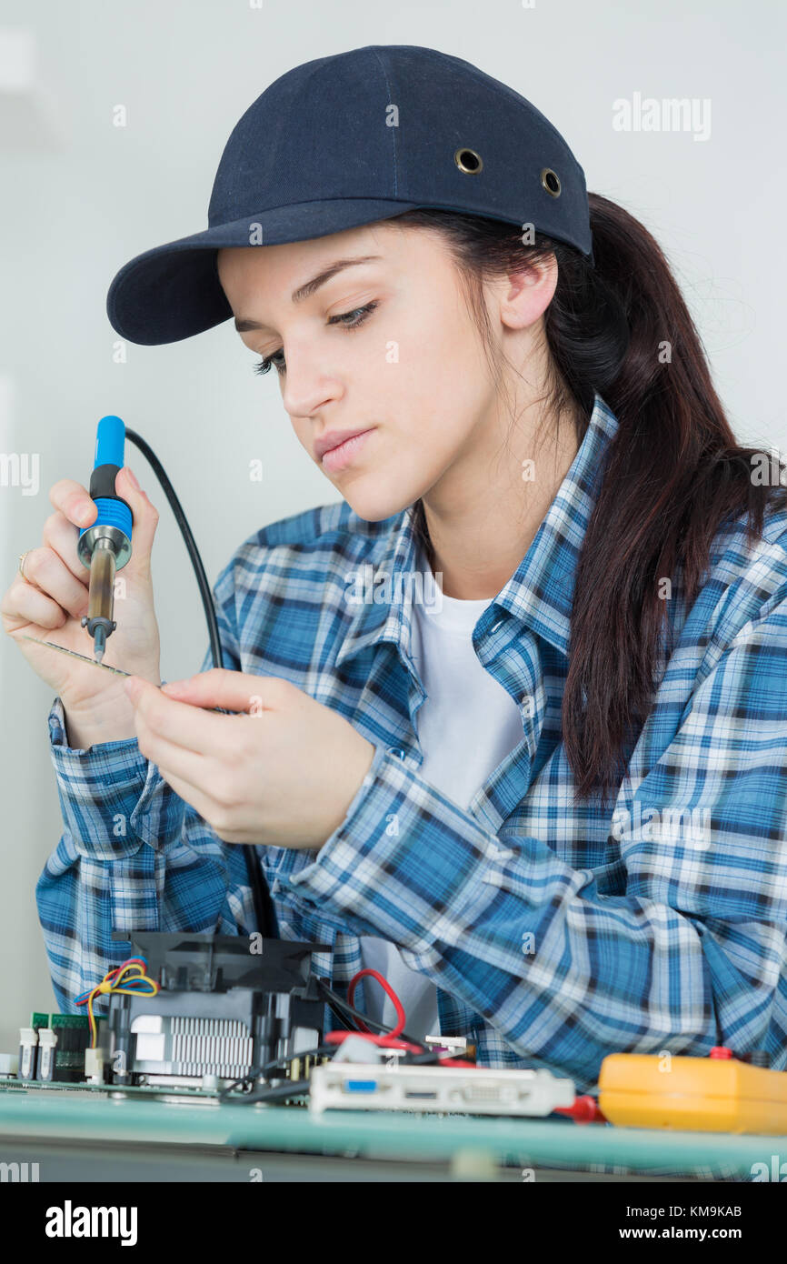 female soldering iron computer parts Stock Photo - Alamy