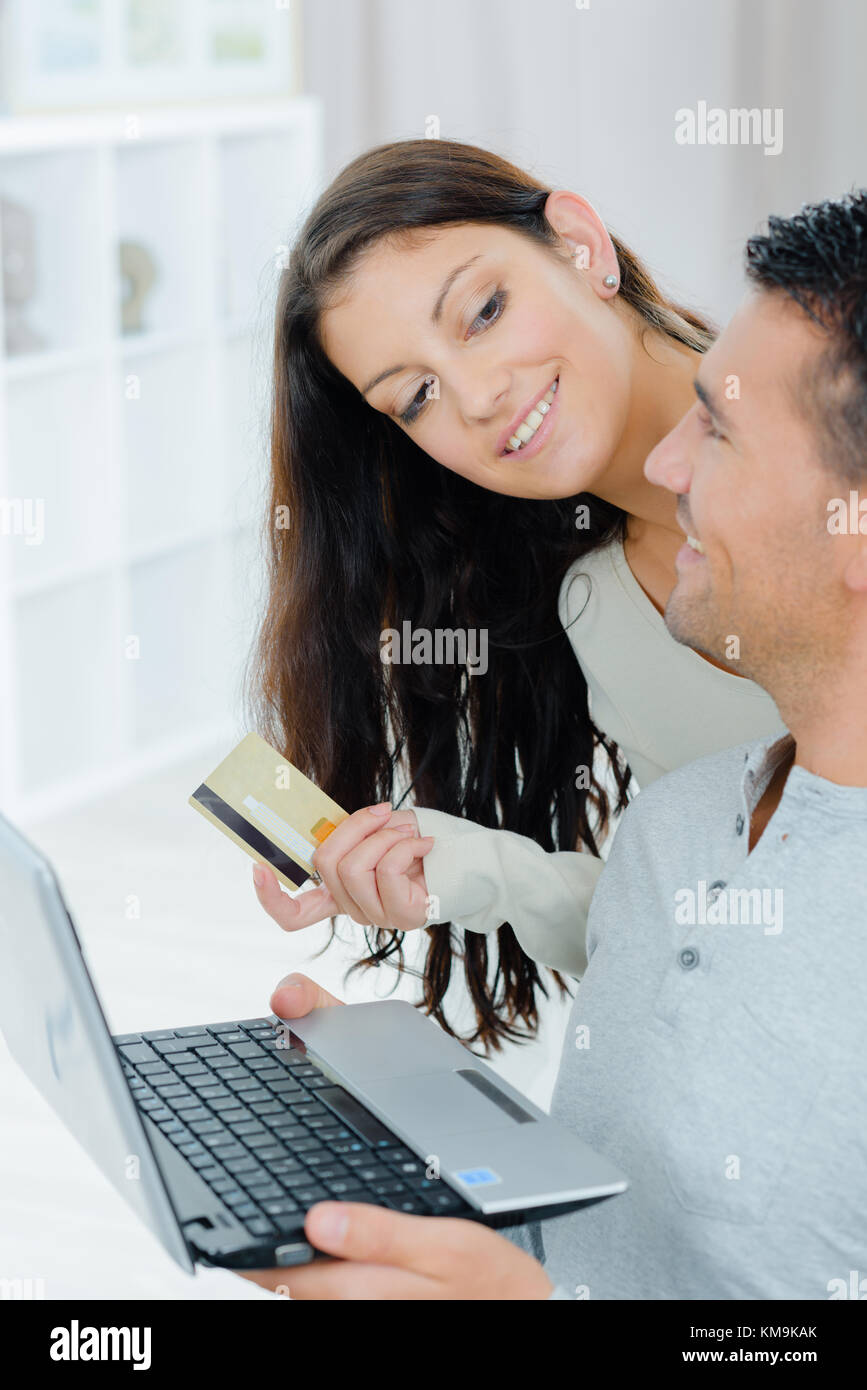 wife giving the card to the husband Stock Photo - Alamy
