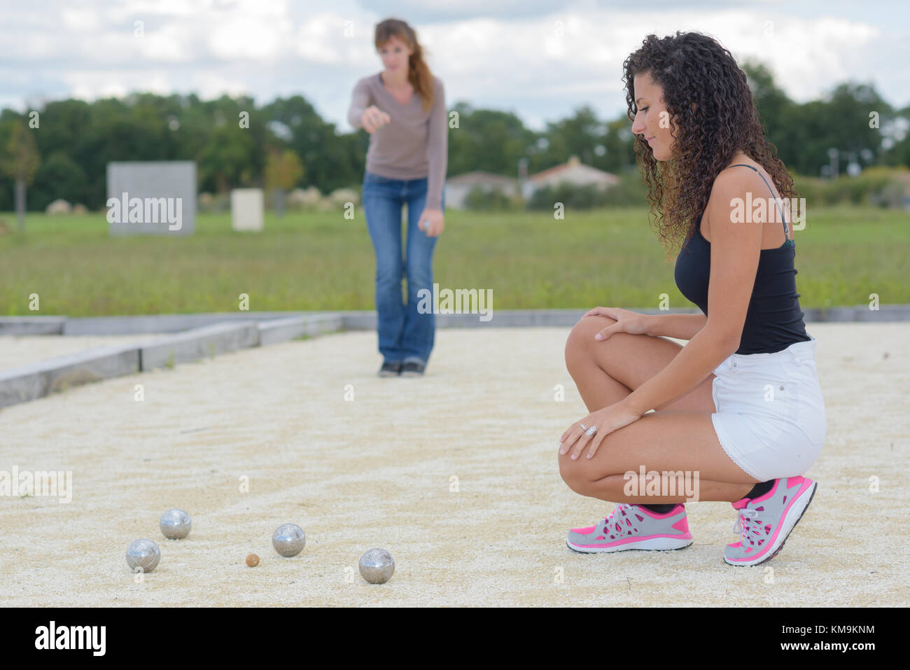 Women playing outdoor boules Stock Photo - Alamy