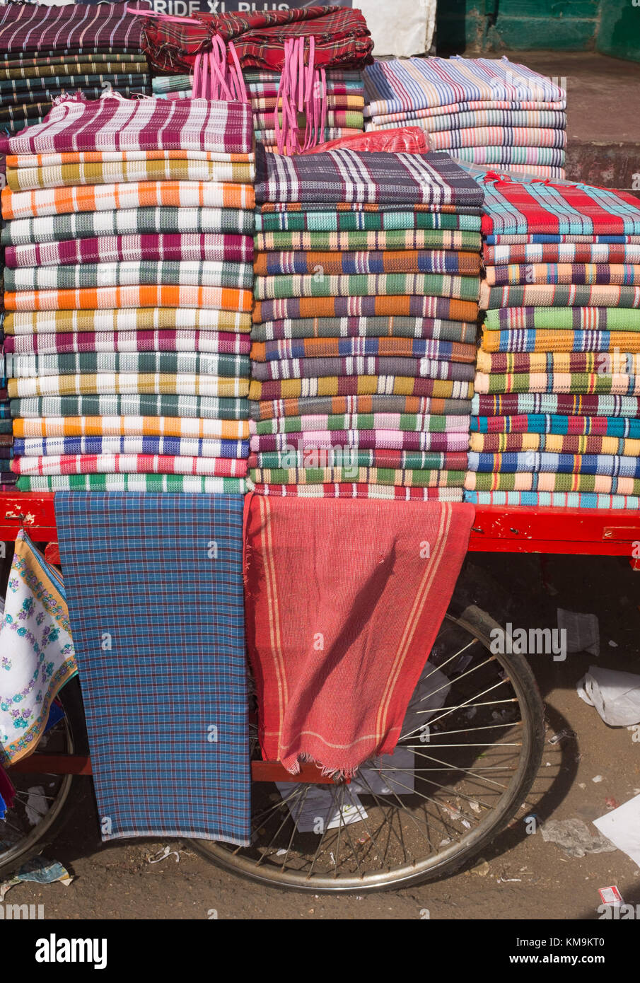 Colourful cloth stacked on cart in street market at Mysore, Mysuru ...