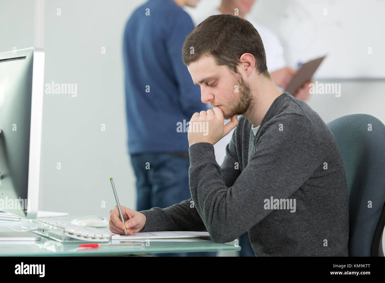 Solving an assignment hi-res stock photography and images - Alamy