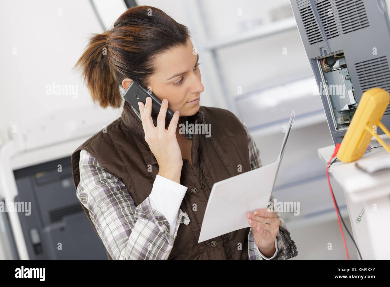 engineer on the phone working with circuits Stock Photo - Alamy