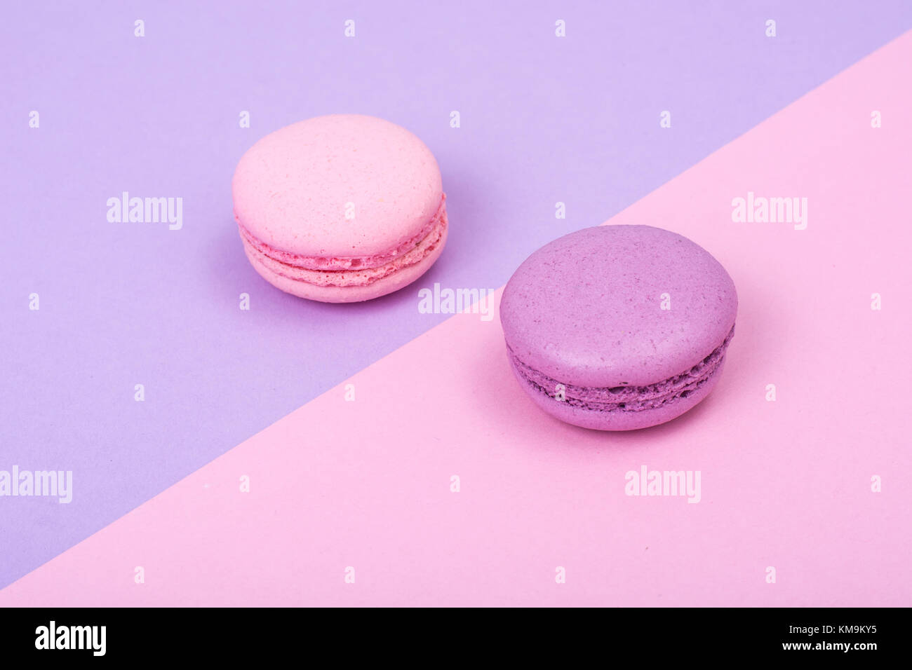 Small French macaroons on pastel background. Studio Photo Stock Photo ...
