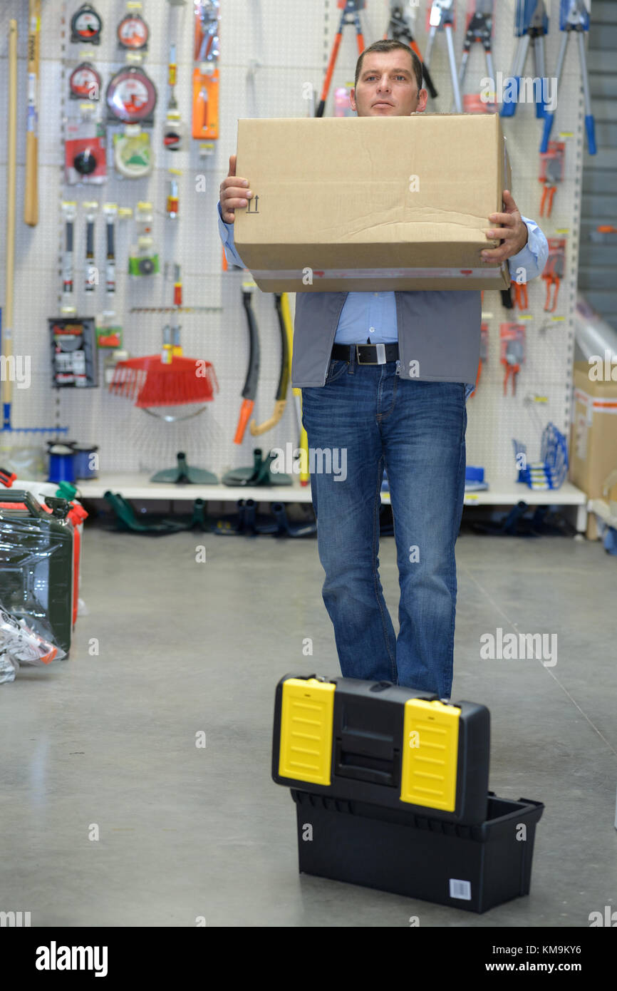 delivery man carrying boxes Stock Photo - Alamy