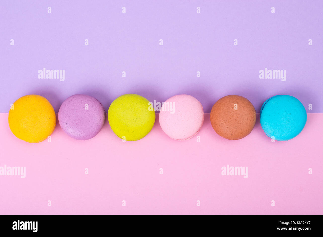 Small French macaroons on pastel background. Studio Photo Stock Photo ...