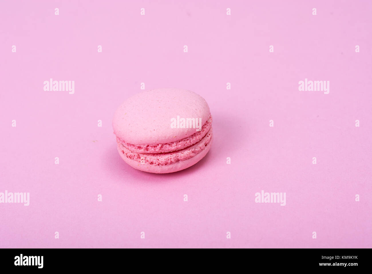 Small French macaroons on pastel background. Studio Photo Stock Photo ...