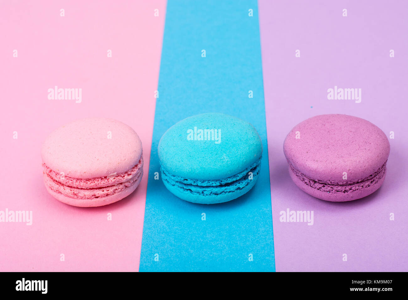 Small French macaroons on pastel background. Studio Photo Stock Photo ...