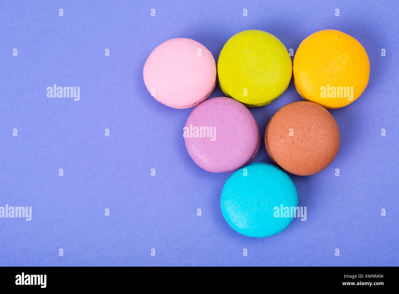 Small French macaroons on pastel background. Studio Photo Stock Photo ...