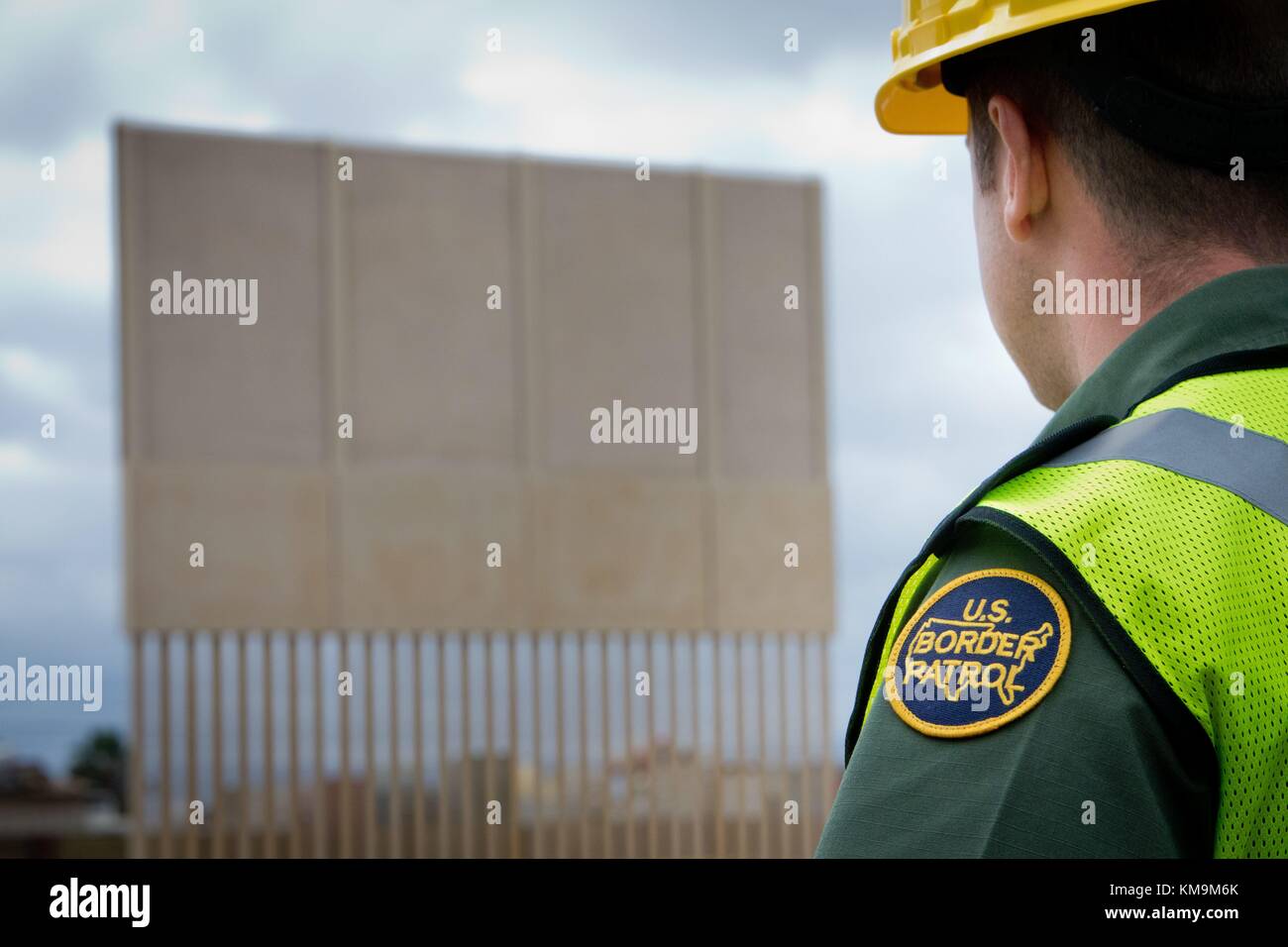 An officer of the U.S. border patrol is looking at one of the ...