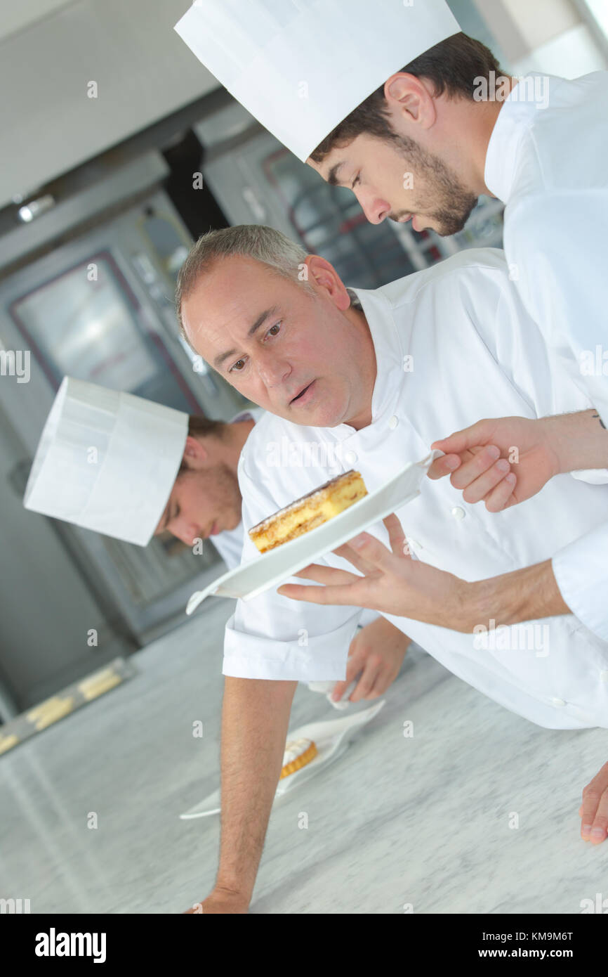 confectioner apprentice in kitchen Stock Photo - Alamy