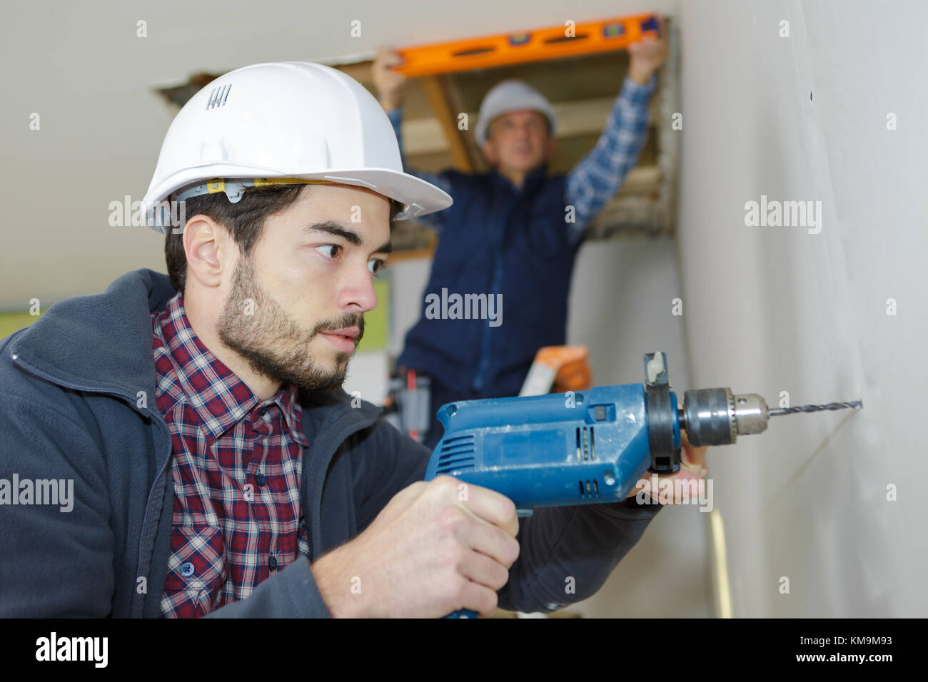 worker is drilling concrete wall construction site Stock Photo - Alamy