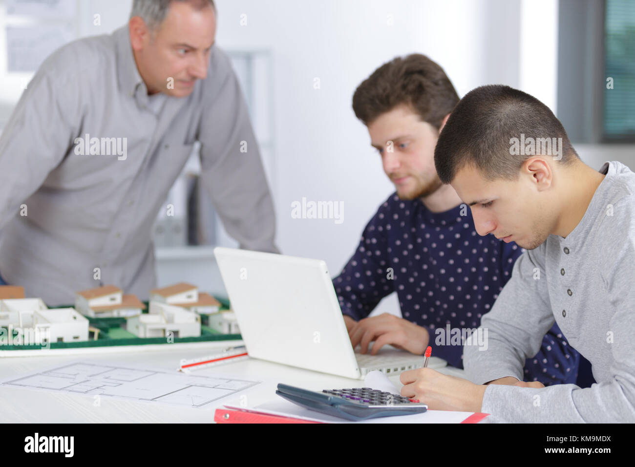 Trainee architects at desk Stock Photo - Alamy
