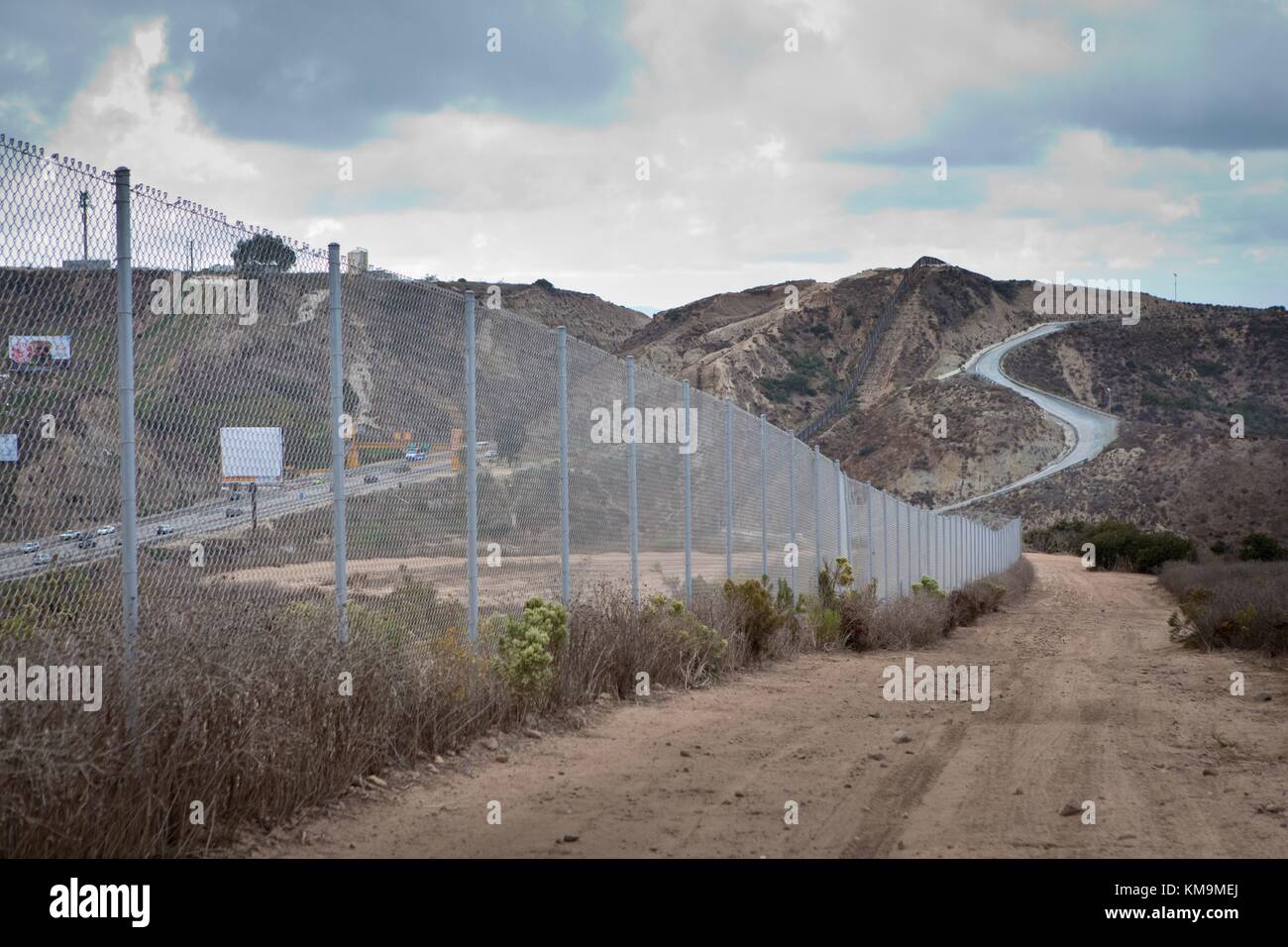 Fence at the Mexico–United States border, Tijuana on the left, San ...
