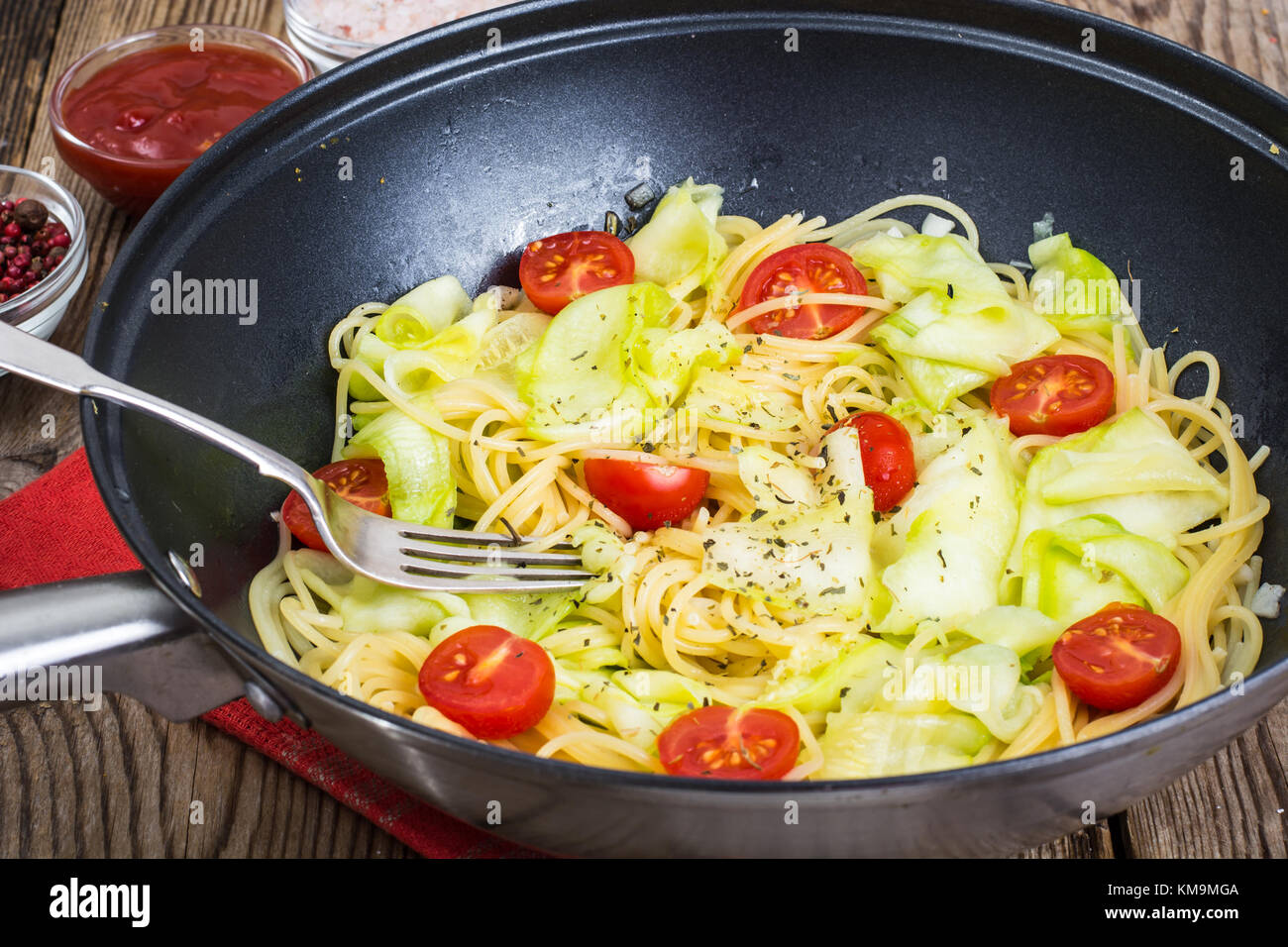 Frying pan wok with spaghetti with vegetables. Studio Photo Stock Photo ...
