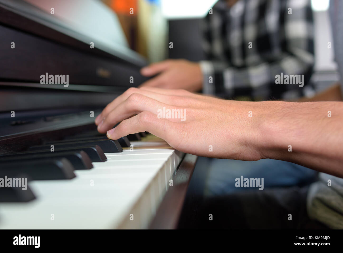 pressing a piano Stock Photo - Alamy