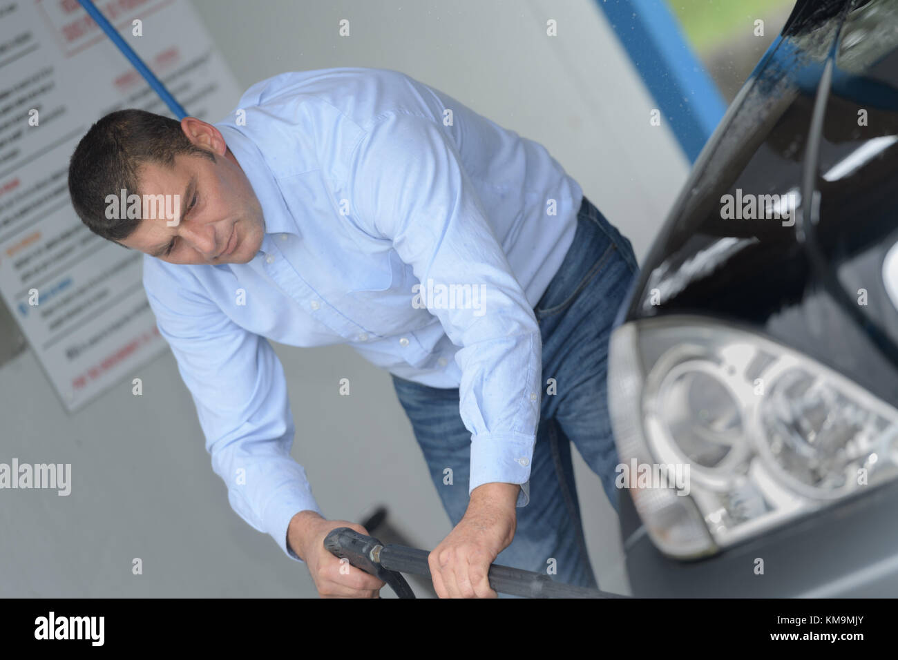 Man washing car Stock Photo - Alamy